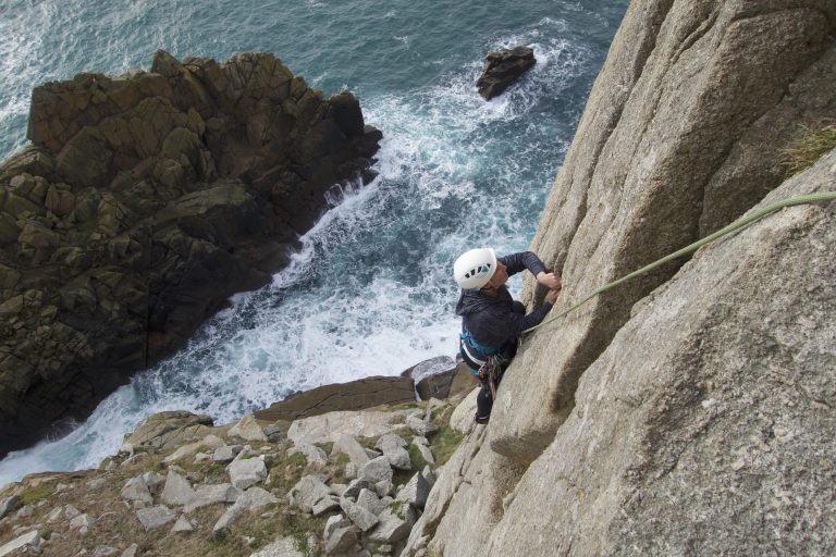 Emma following Doorpost at Bosigran. - Snowdonia Mountain Guides